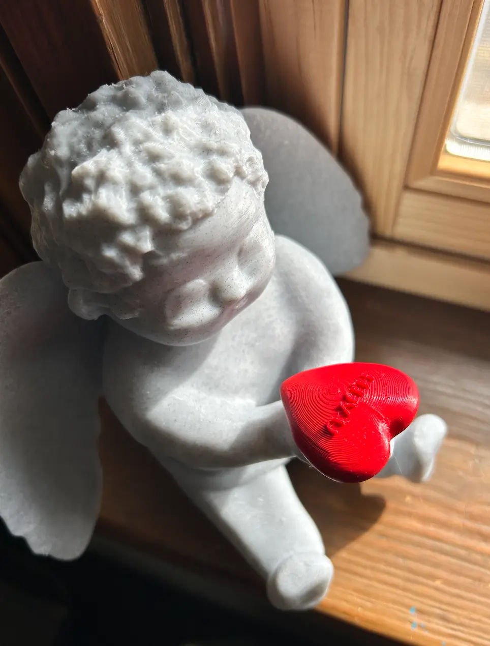 Free Sculptures & Artworks STL Download - Cute Cupid Holding a Heart ...