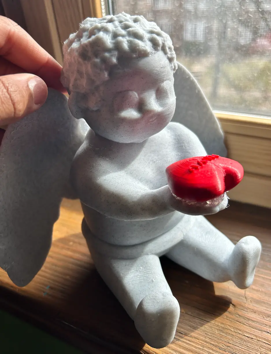 Free Sculptures & Artworks STL Download - Cute Cupid Holding a Heart ...
