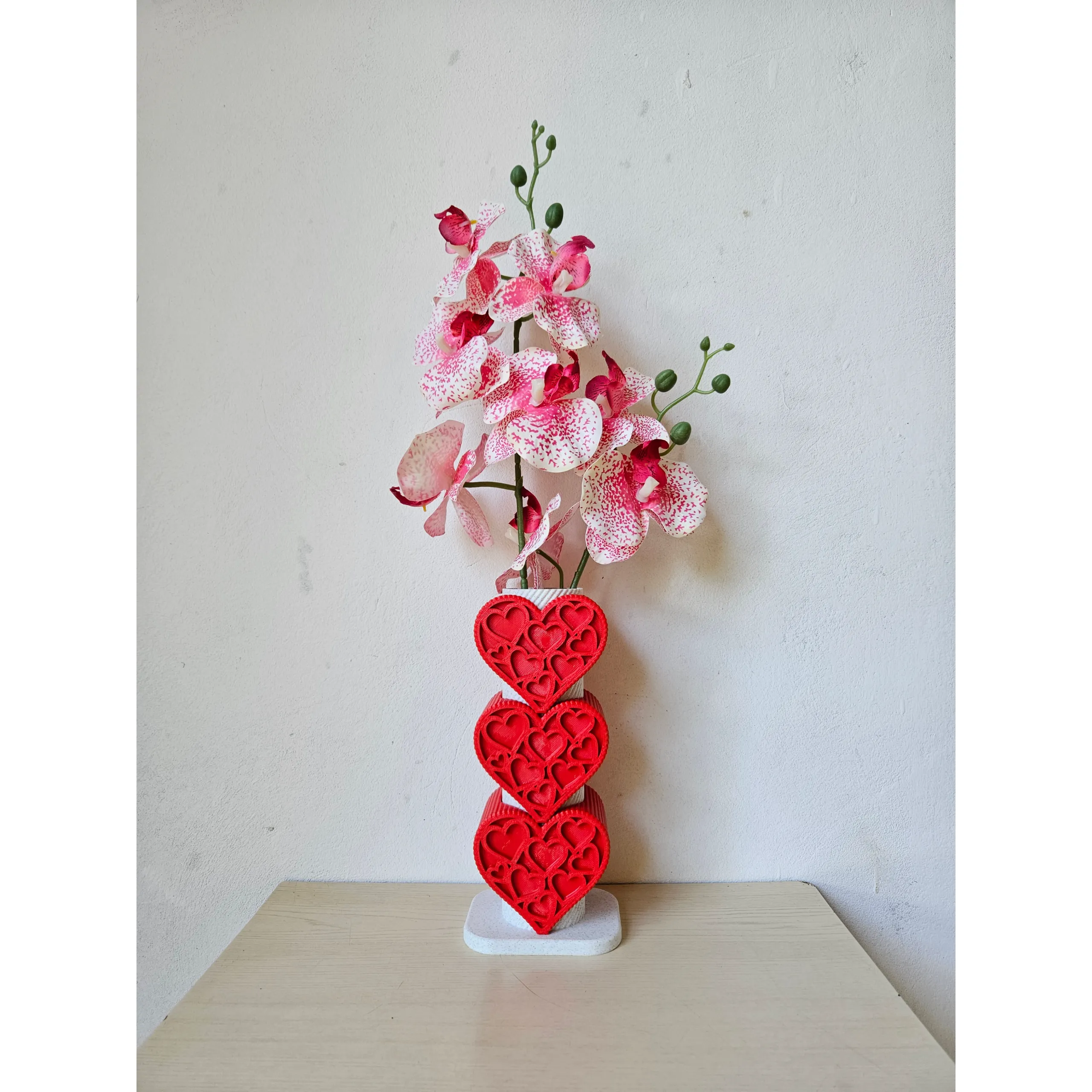 This is a 3D printed Mother's Day vase with a stand and heart shaped ...