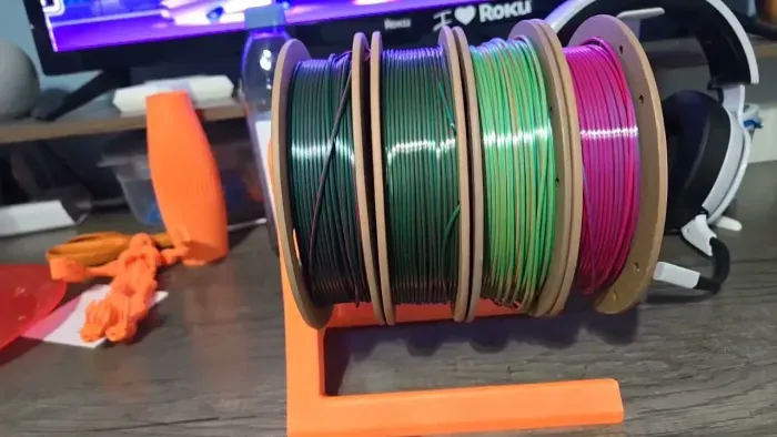 This is a spool holder for filament. It can hold 4 250g spools or 2 1kg ...