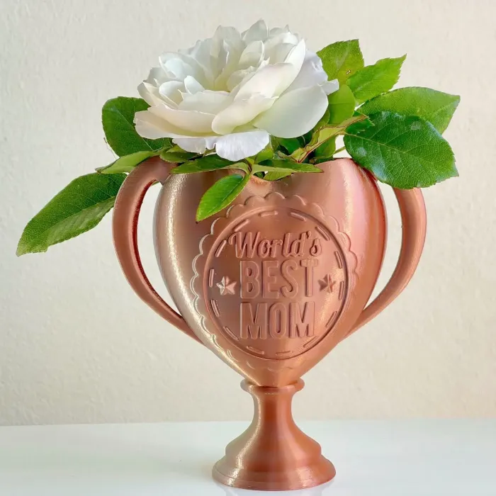 Design Concept The design celebrates motherhood with a trophy that ...
