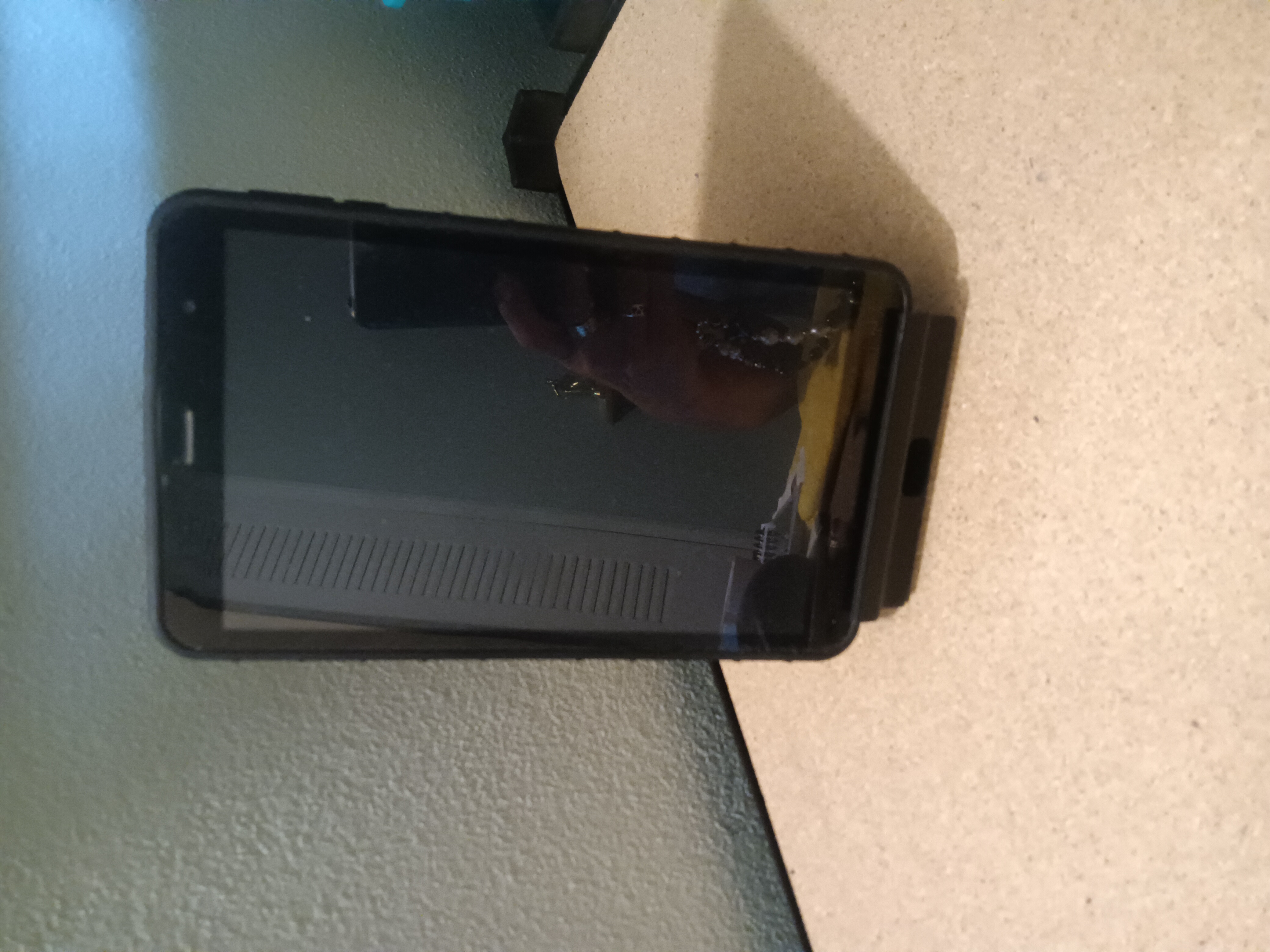 Perfect! It is completely firm and very strong. It works for both cell ...